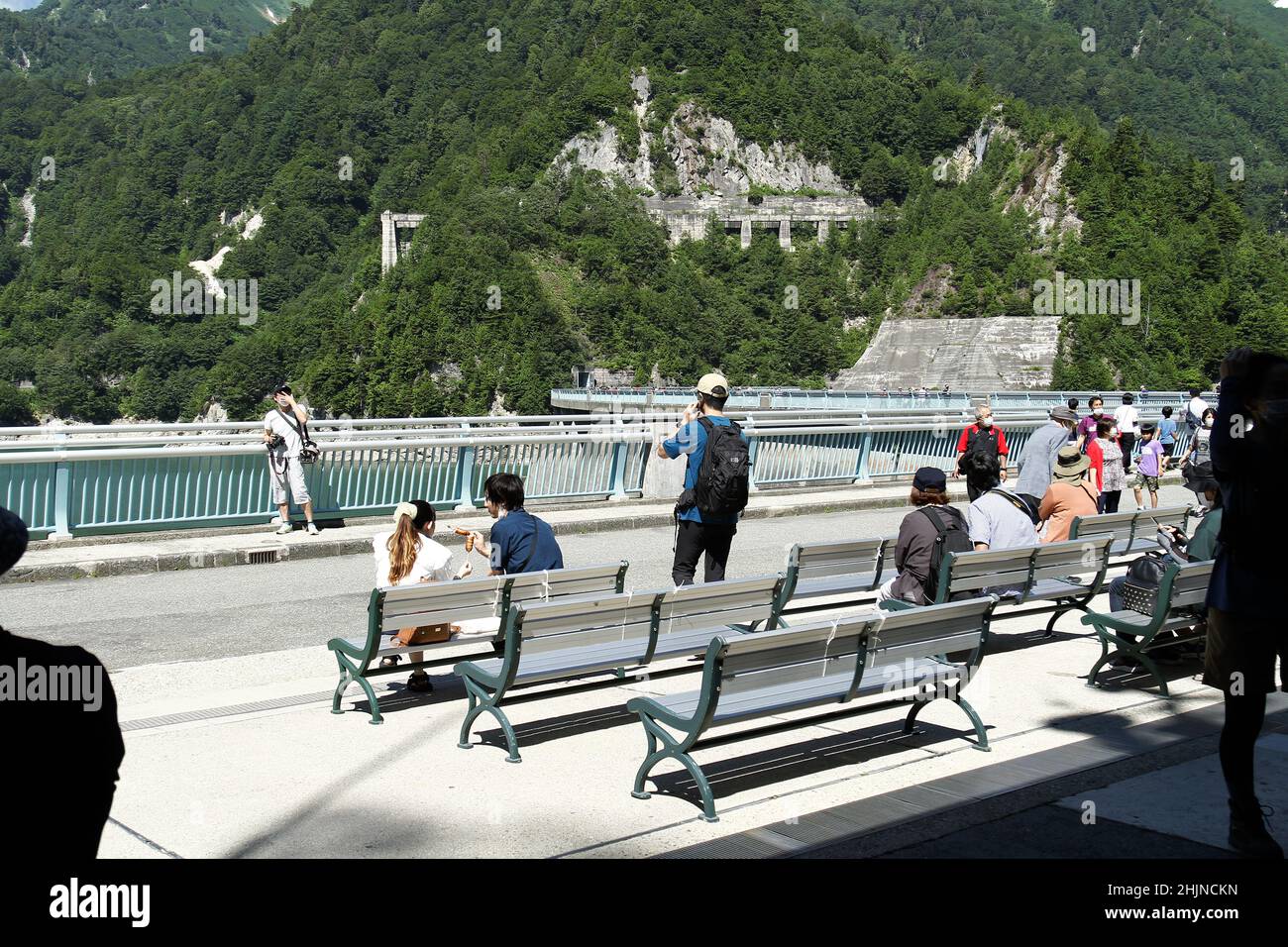 Nagano, Japan, 2021-23-07 , Tourists resting near the Kurobe dam in ...