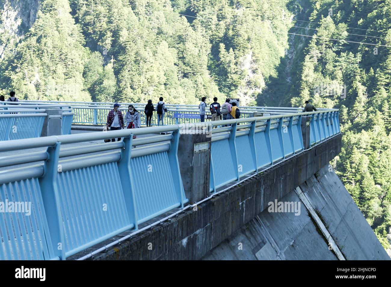 Nagano, Japan, 2021-23-07 , people crossing the Kurobe dam in Nagano ...