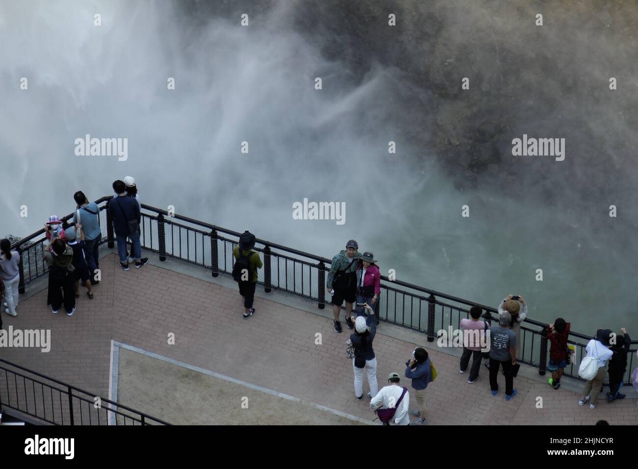 Nagano, Japan, 2021-23-07 , people watching the water jets of the dam ...