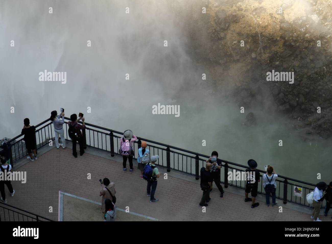 Nagano, Japan, 2021-23-07 , people watching the water jets of the dam ...