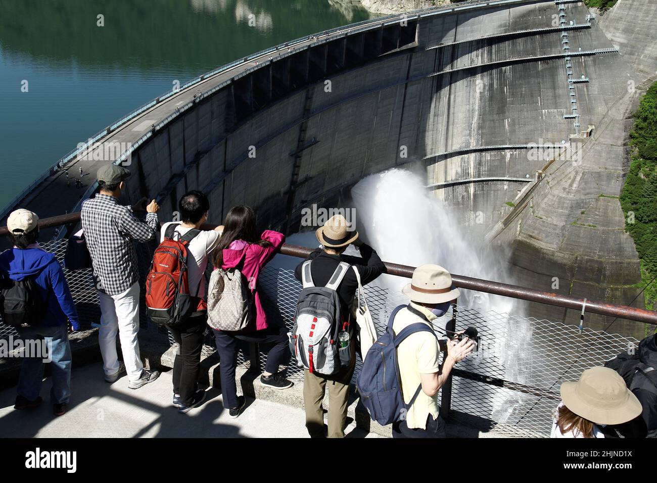 Nagano, Japan, 2021-23-07 , people watching the water jets of the dam ...