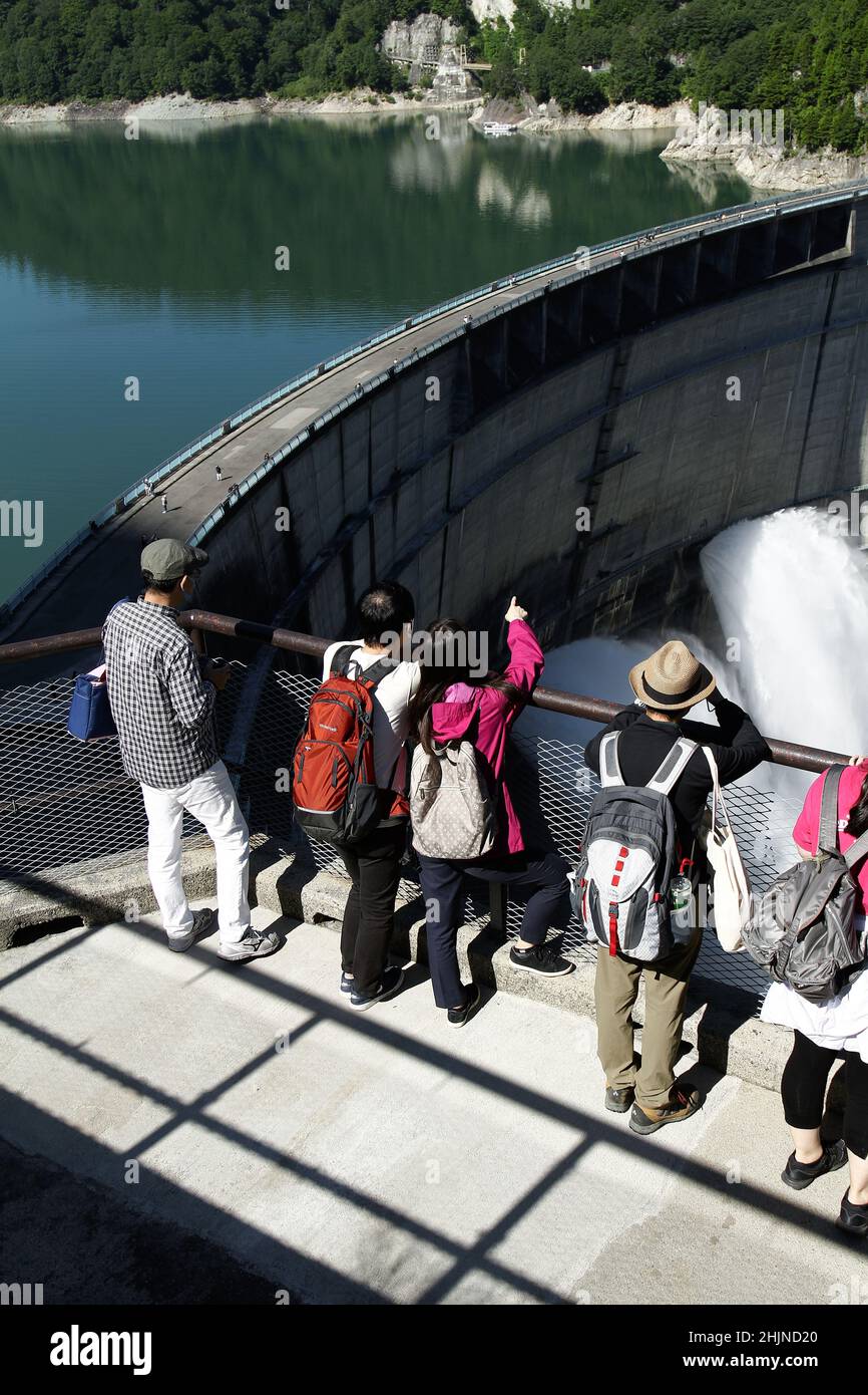 Nagano, Japan, 2021-23-07 , people watching the water jets of the dam ...