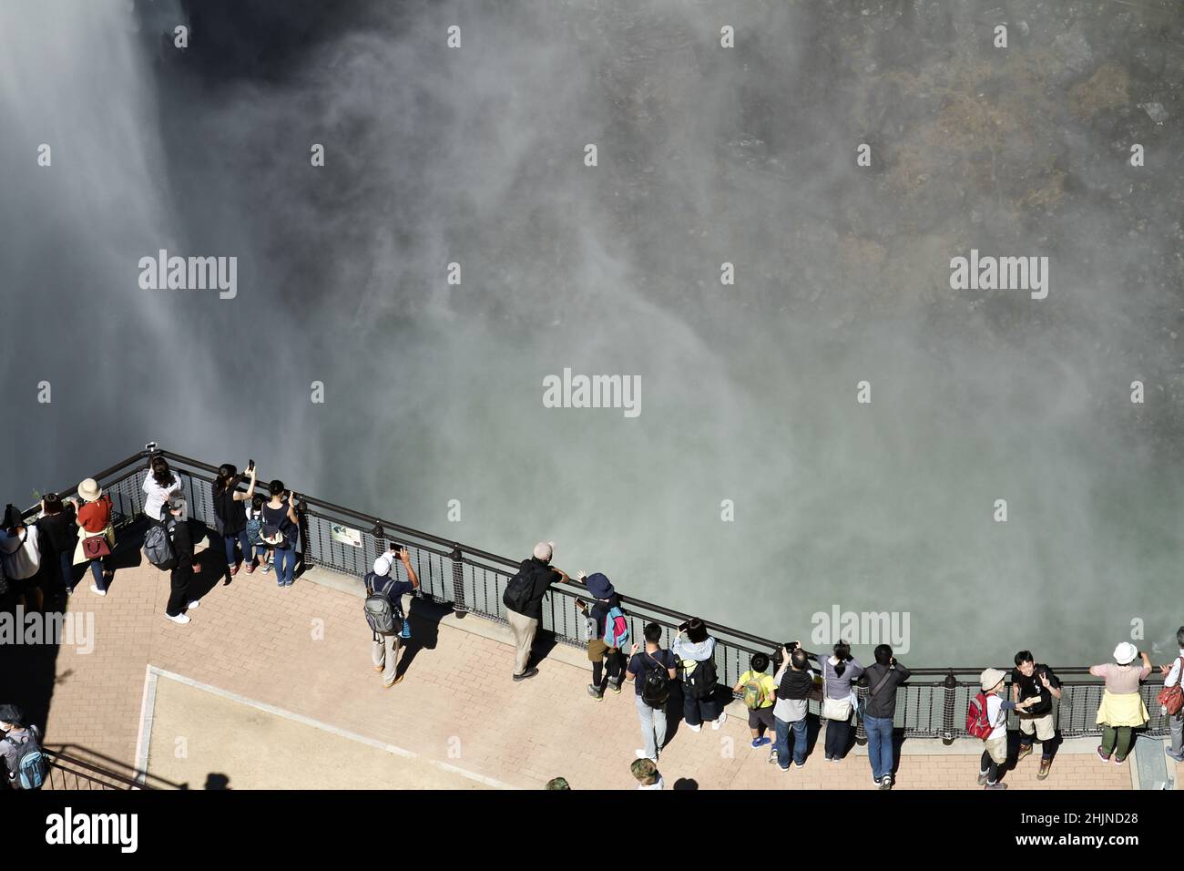 Nagano, Japan, 2021-23-07 , people watching the water jets of the dam ...