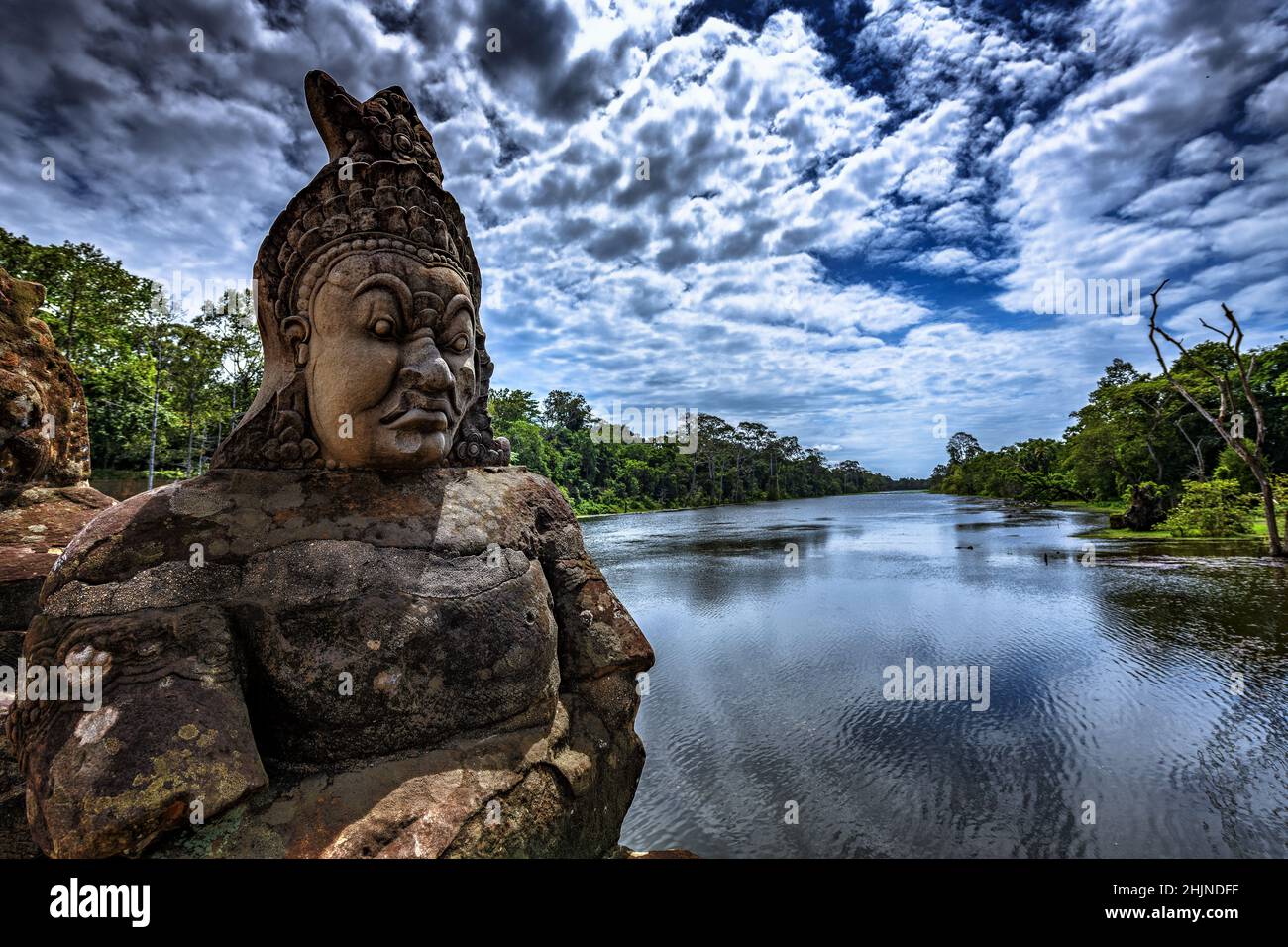 Unique stone statue at the entrance of Angkor Thom in the Angkor Wat ...