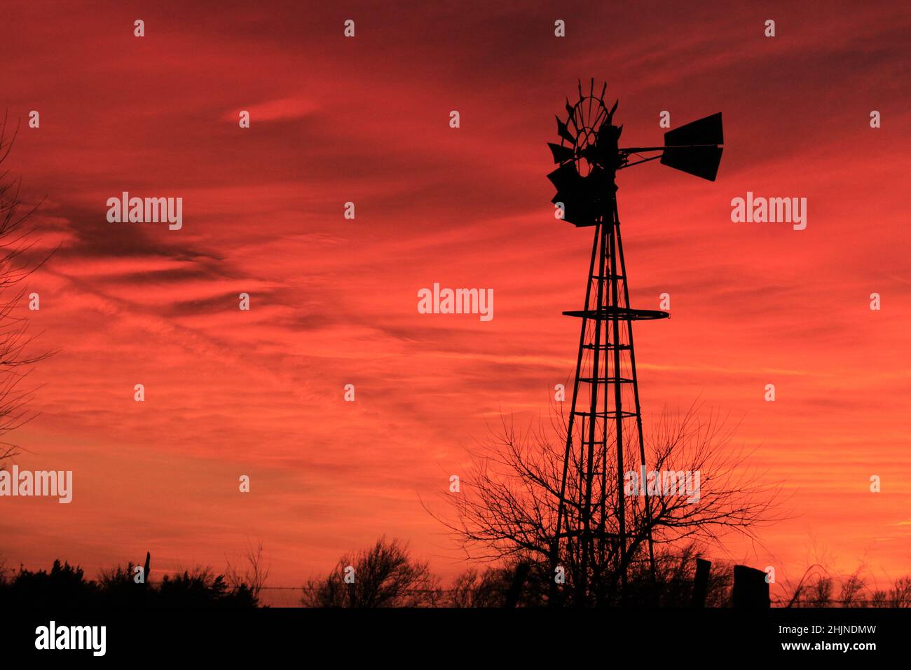 Kansas Blazing Red Sunset with a Farm Windmill silhouette north of ...