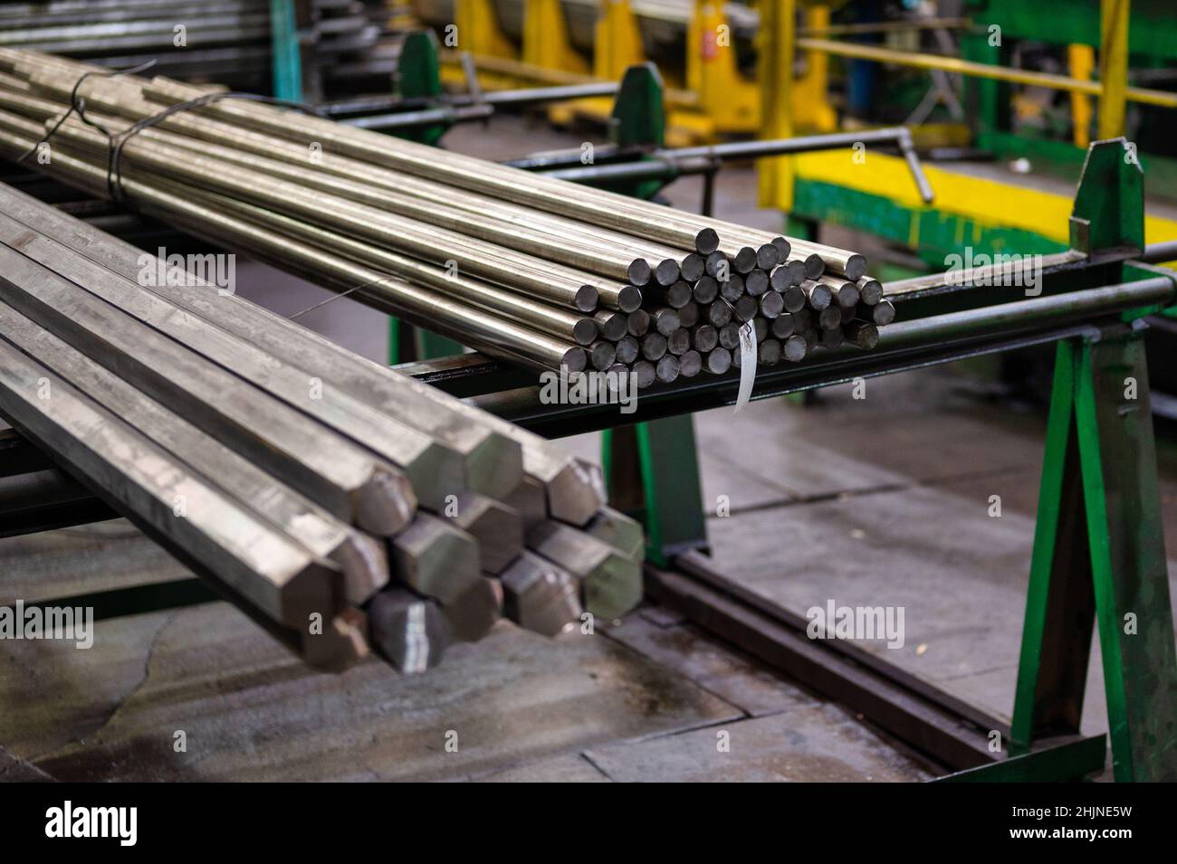 Bundle of hexagonal metal rods, hot rolled steel Stock Photo - Alamy