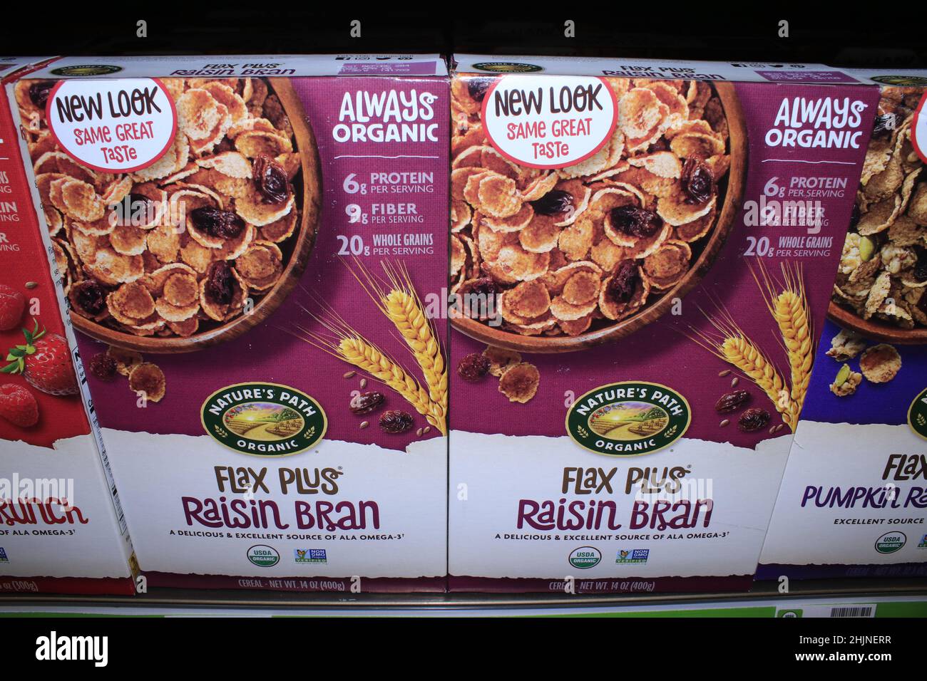 Nature's Path Raisin Bran shot closeup on a metal shelf in a grocery ...