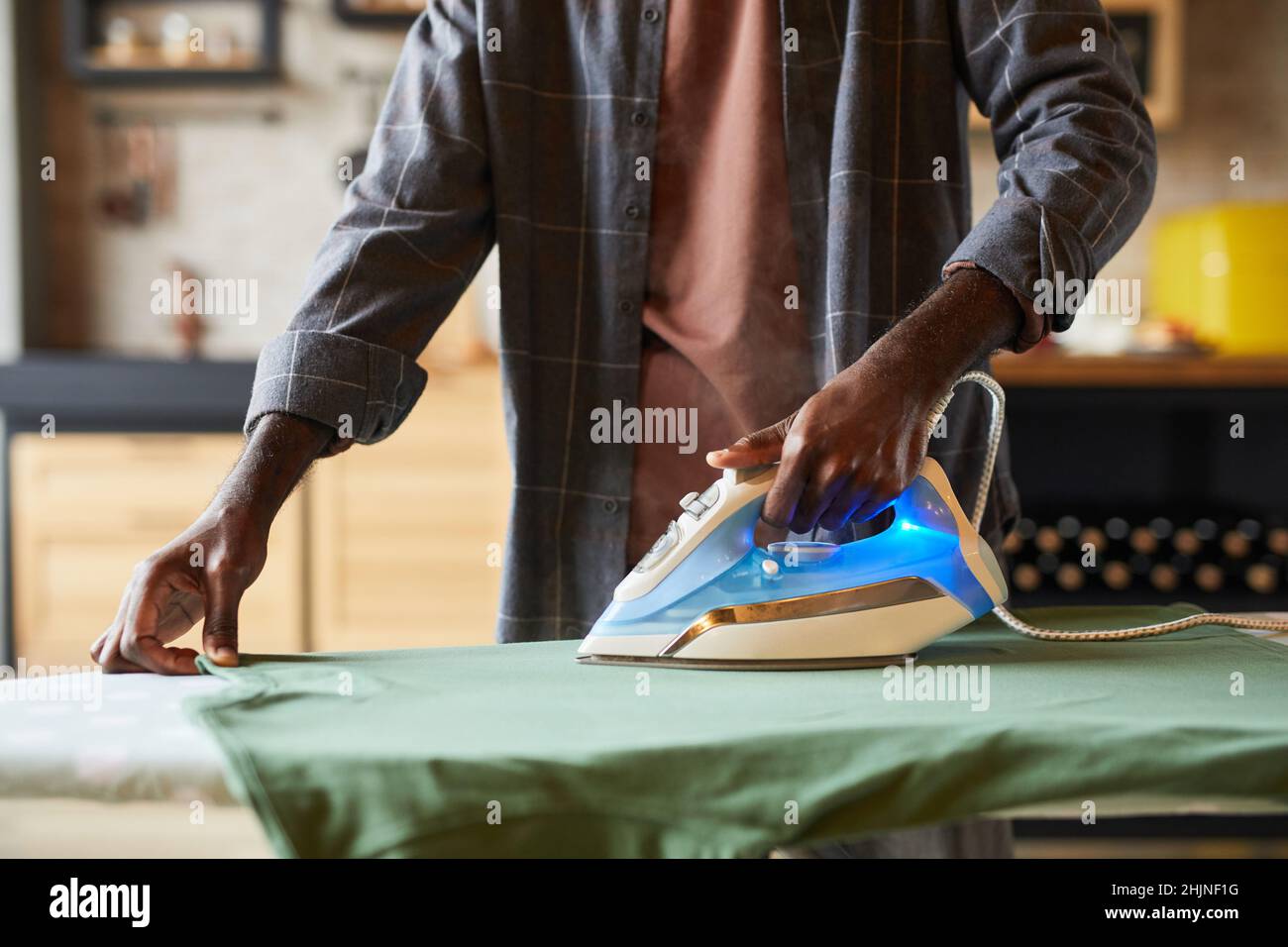 Man house chores black hi-res stock photography and images - Alamy