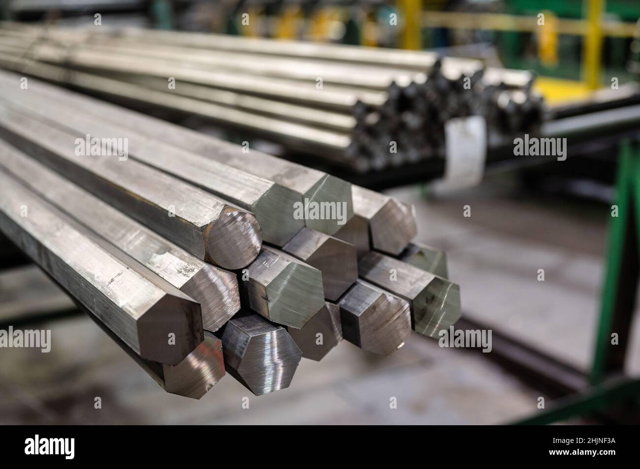 Bundle of hexagonal metal rods, hot rolled steel Stock Photo - Alamy