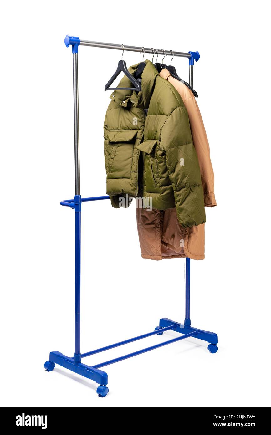 Clothes hang on clothing rack over white background Stock Photo - Alamy