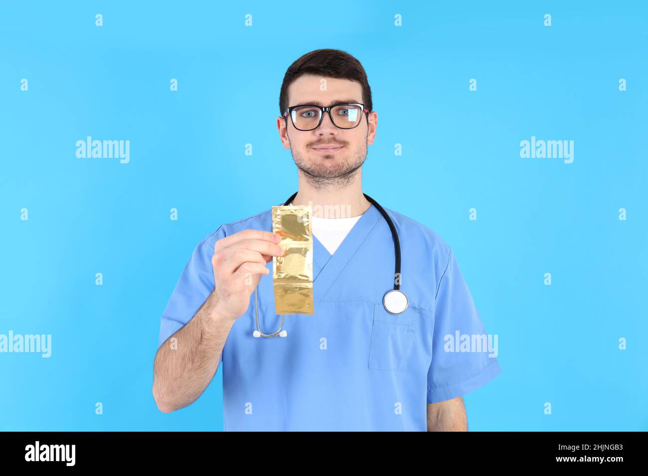 Handsome doctor cardiologist holding hi-res stock photography and ...
