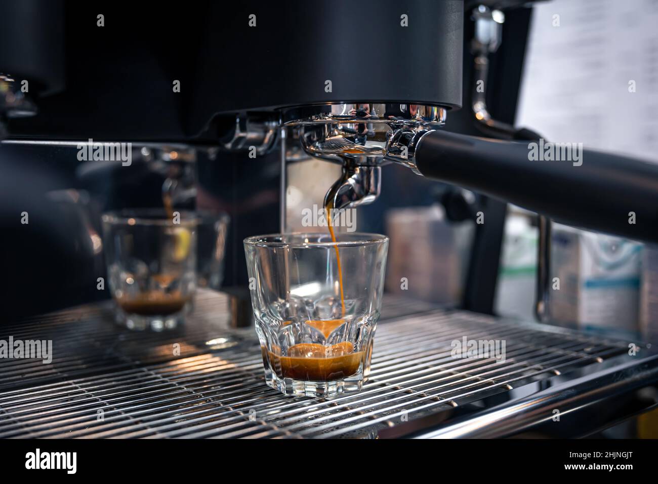 The process of preparing espresso in a professional coffee machine ...