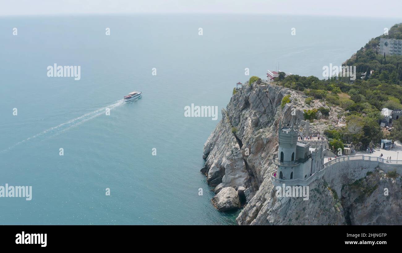 Top view of castle on edge of steep cliff. Action. Beautiful white ...