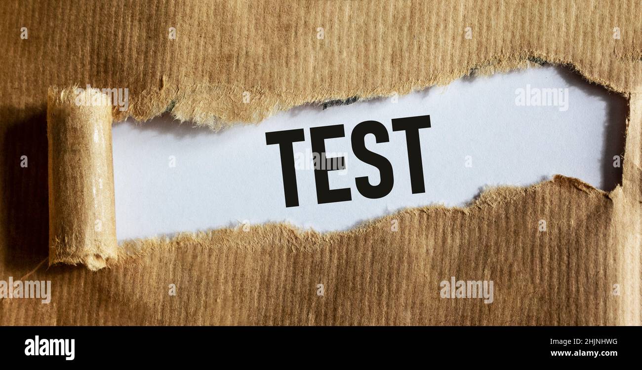 Test word written on torn paper. business concept. Test sign, exam ...