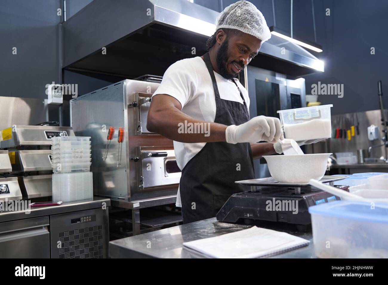 Chef measures the weight of the ingredients before cooking Stock Photo ...
