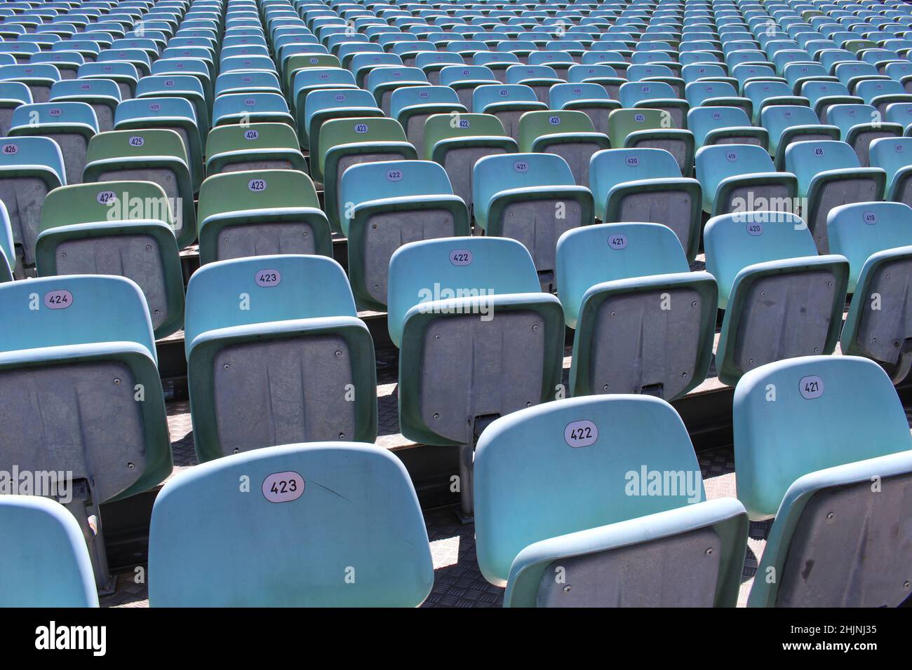 Folded empty seats in a stadium Stock Photo - Alamy