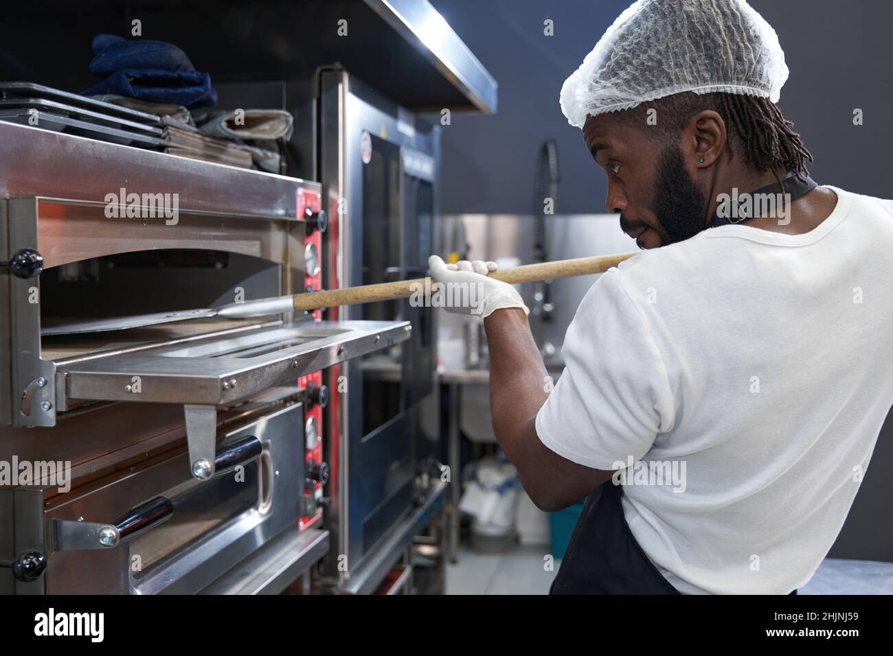 Adult chef hard working, baking food in restaurant Stock Photo - Alamy