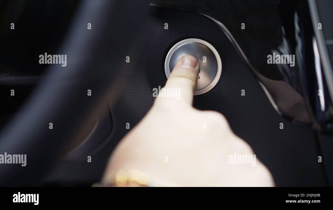 Driver hand pushes engine start stop button. Stock. Modern luxury ... Driver hand pushes engine start stop button. Stock. Modern luxury ...