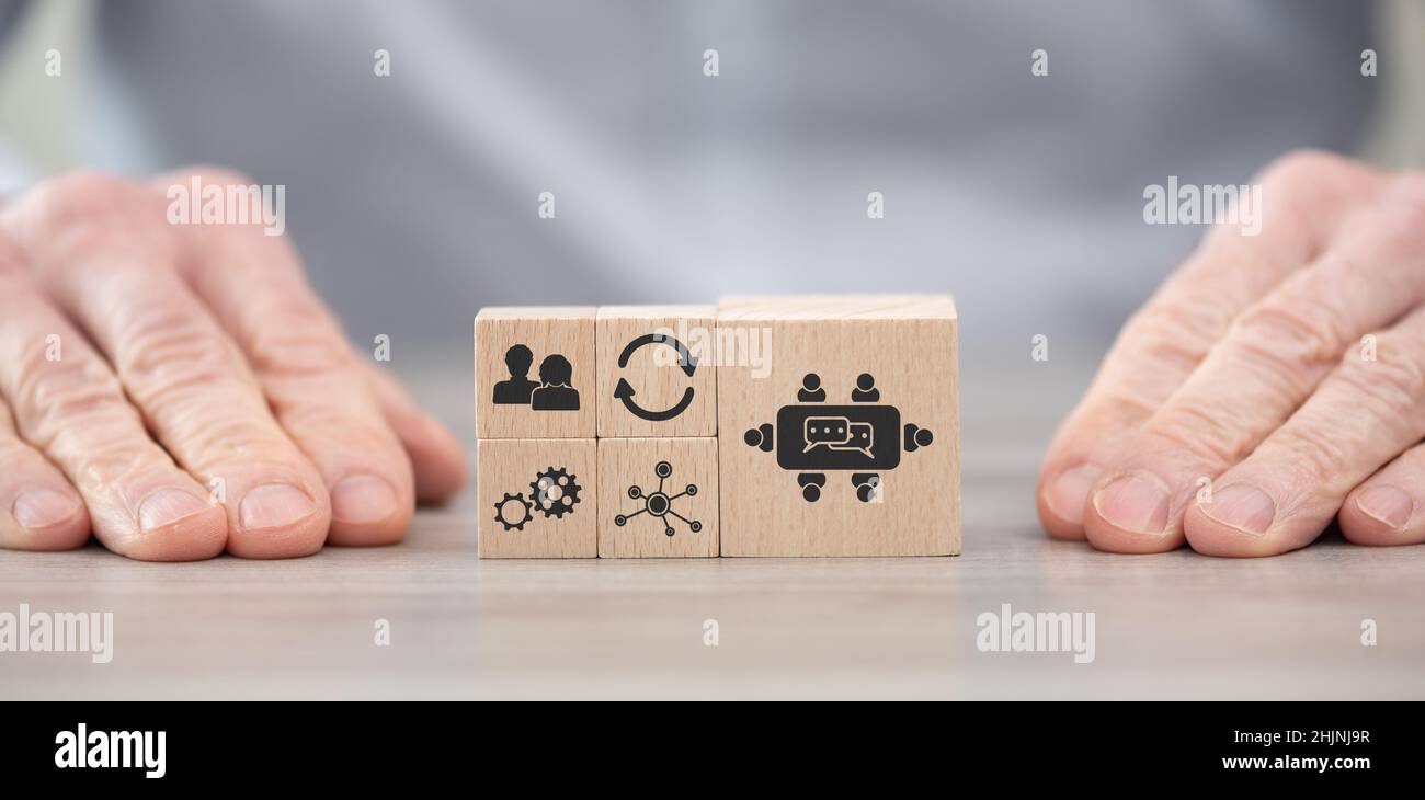 Wooden blocks with symbol of meeting concept Stock Photo - Alamy