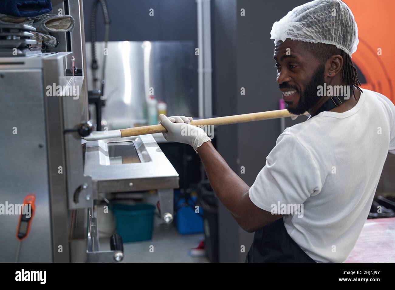 Man hard working, baking food in restaurant Stock Photo - Alamy