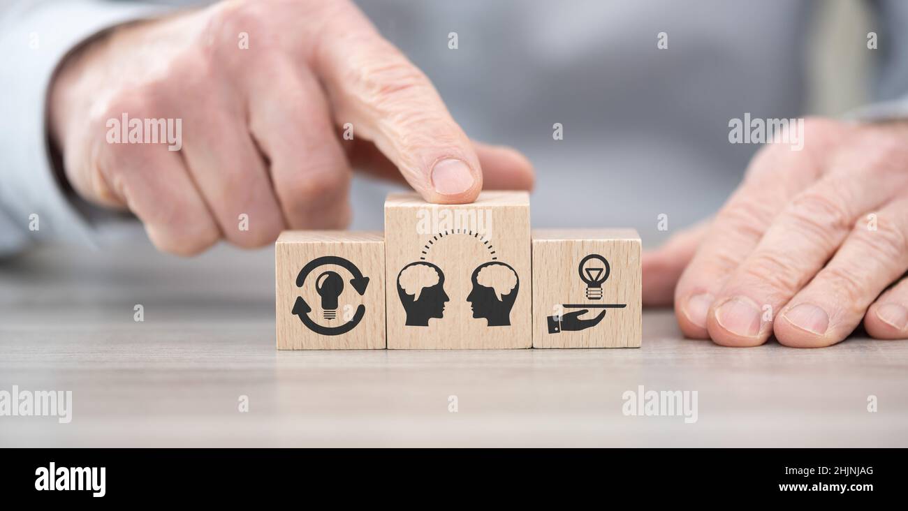 Wooden blocks with symbol of knowledge sharing concept Stock Photo - Alamy