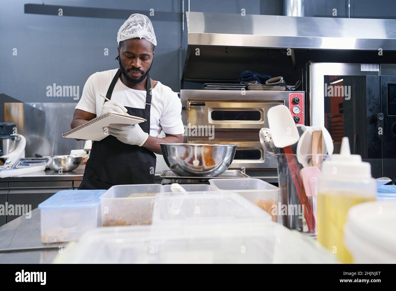 Professional chef hard working at the kitchen Stock Photo - Alamy