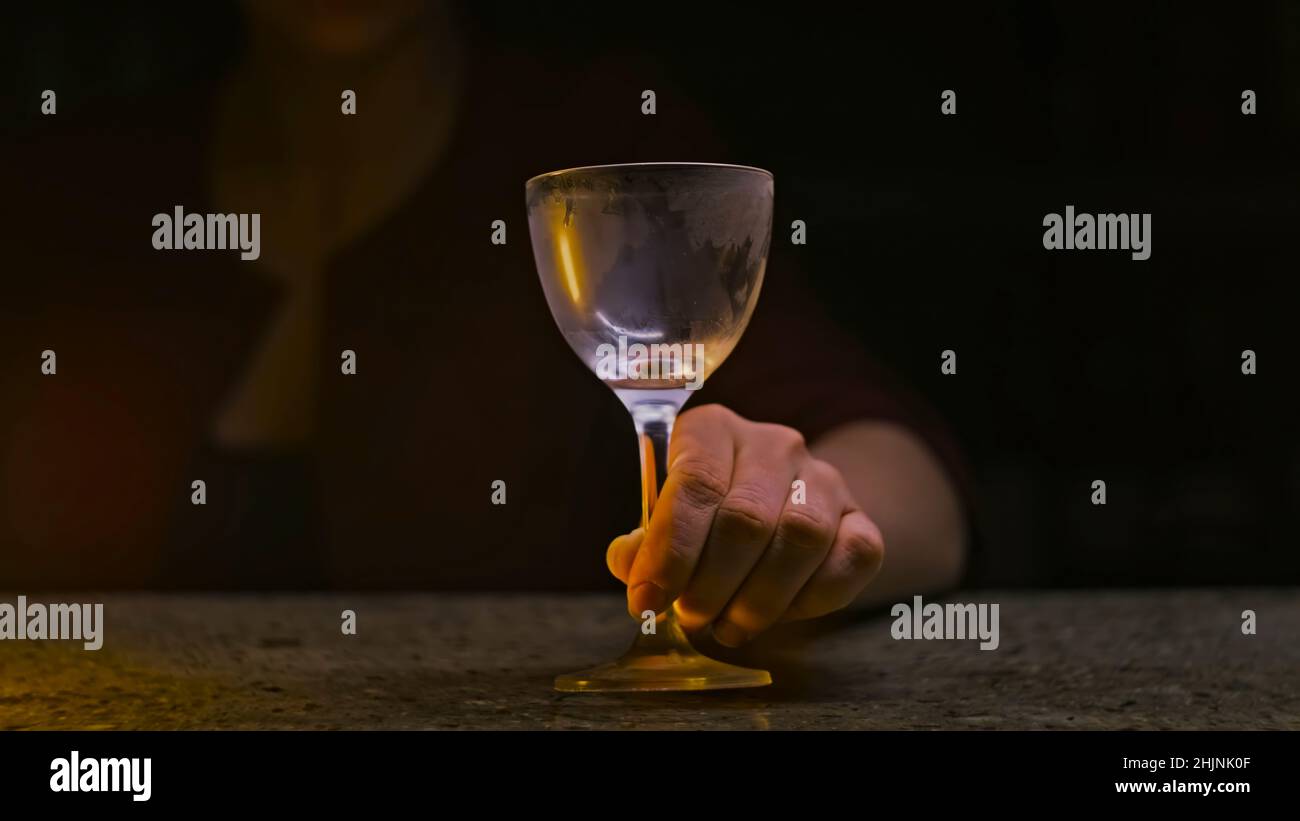 Bartender pours sparkling drink into clear glass. Stock footage. Close-up in transparent glass ...