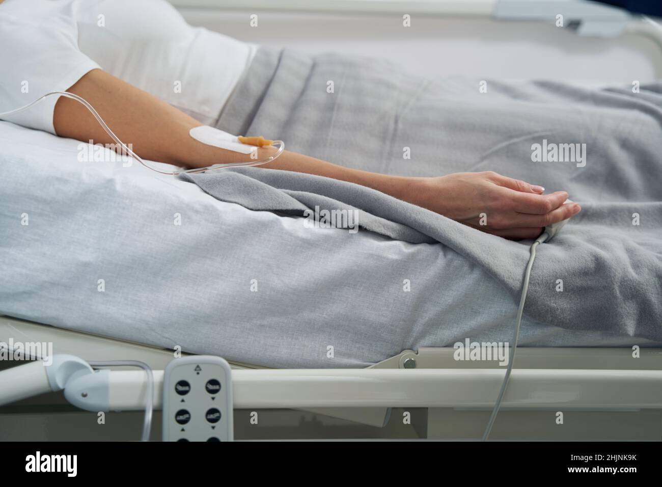 Female patient undergoing intravenous therapy in hospital setting Stock ...