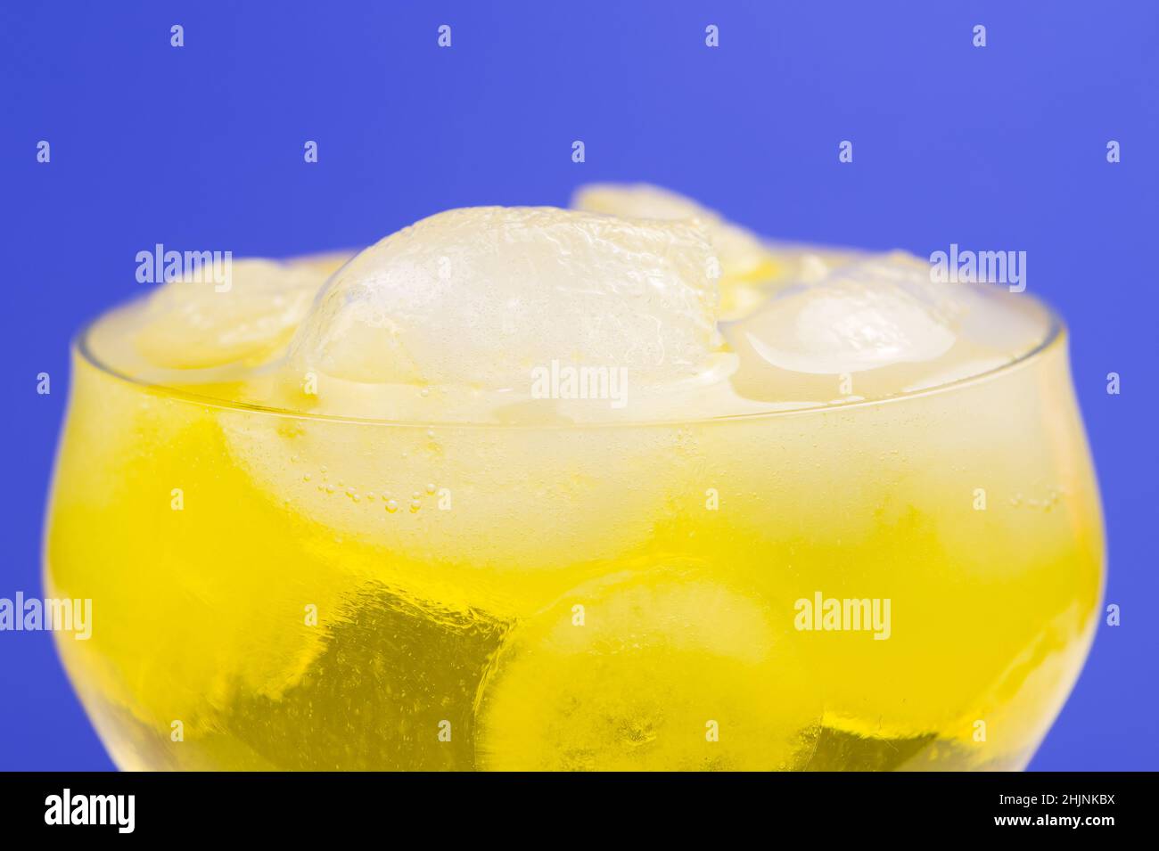 Cold pineapple alcoholic liqueur in drinking glass Stock Photo - Alamy