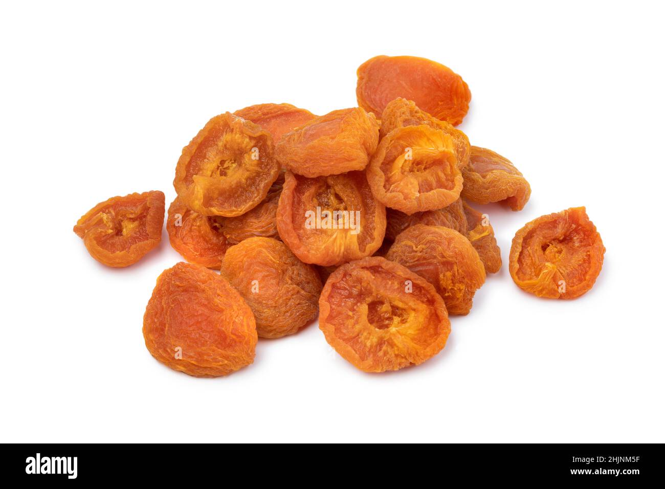 Heap of dried small sour apricots close up isolated on white background ...