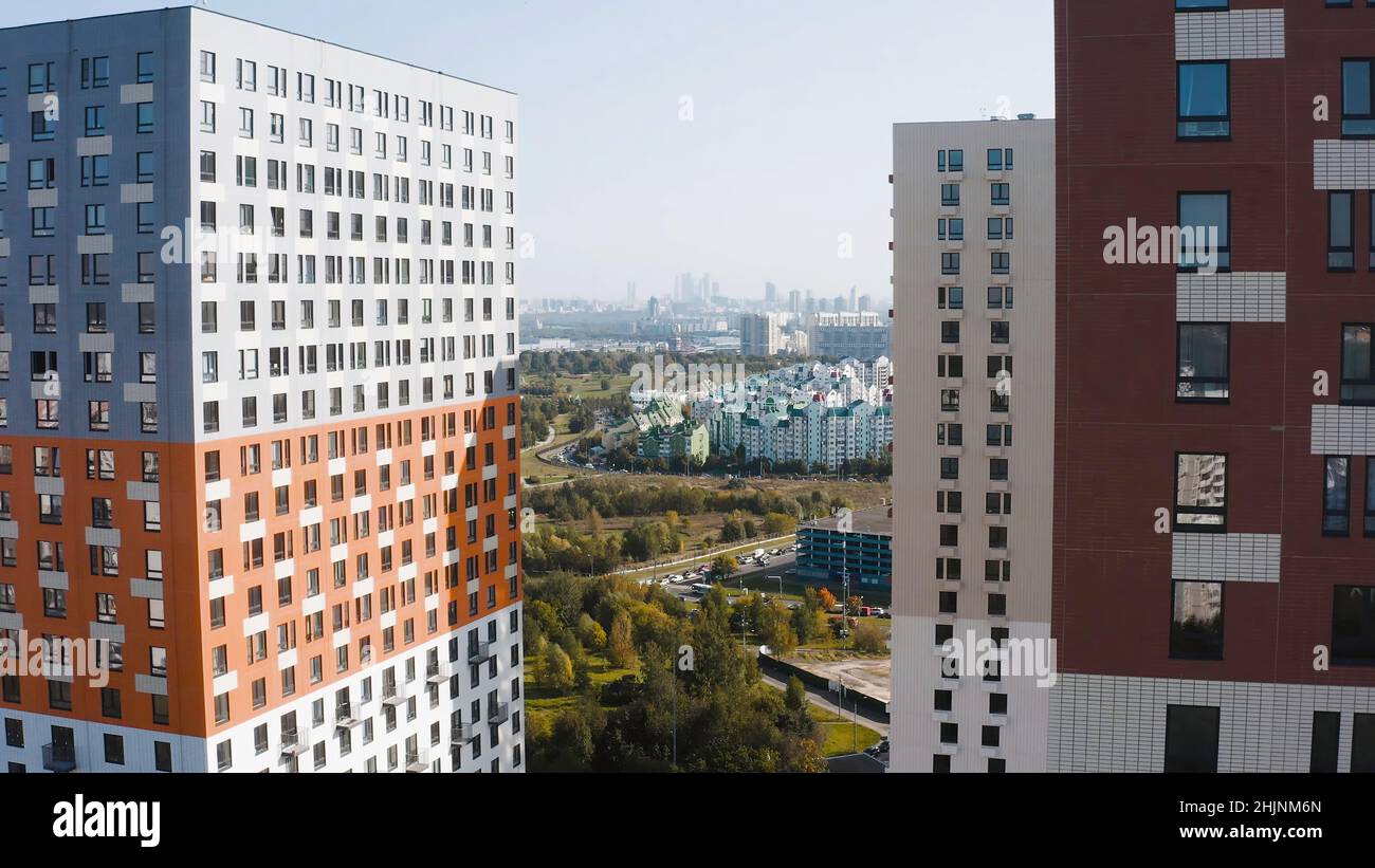 Top view of multi-colored residential complexes in city. Action ...