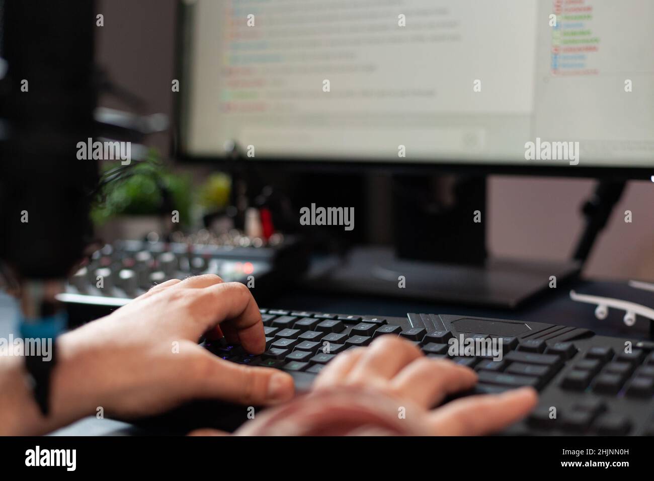 Close up of man using keyboard on live stream chat. Person streaming ...