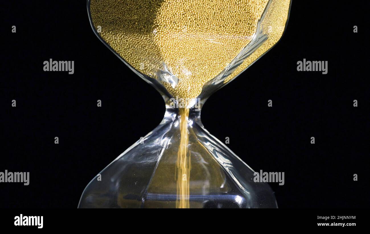 Close-up of golden hourglass. Stock footage. Stylish hexagon hourglass ...
