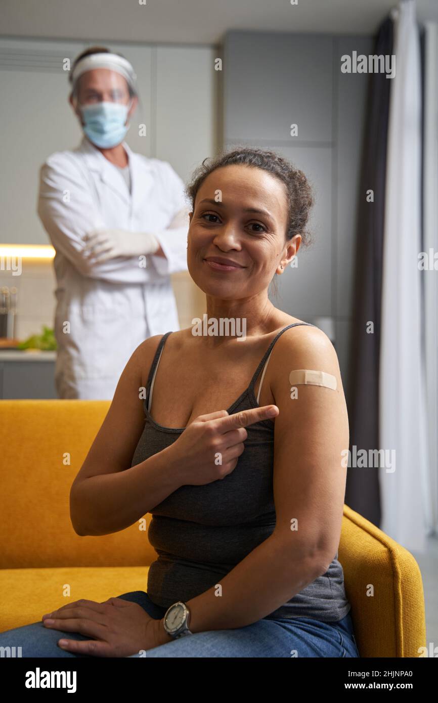 Woman sticking plaster shoulder hi-res stock photography and images - Alamy