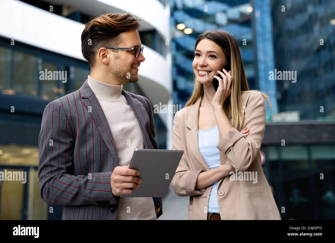 Business people having meeting outdoors hi-res stock photography and ...