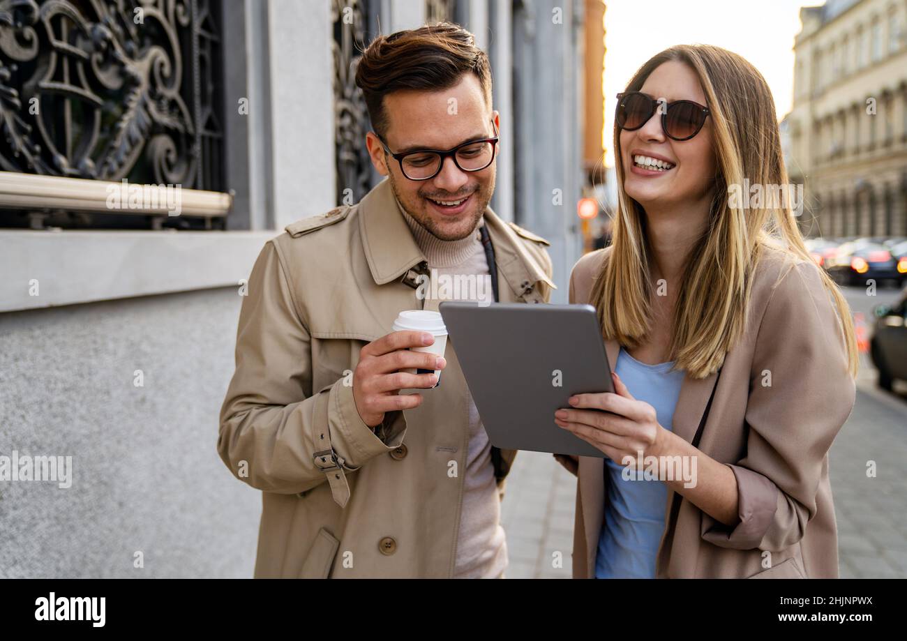 Happy successful business couple in love having fun together in urban ...