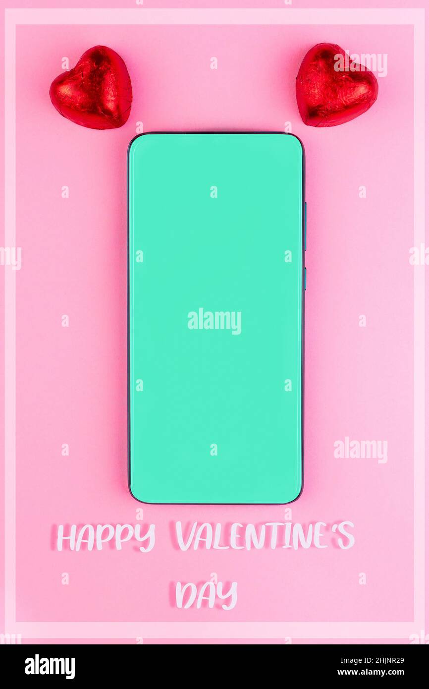 Concept of February 14 or Valentine's Day. Chocolate candy hearts in a ...