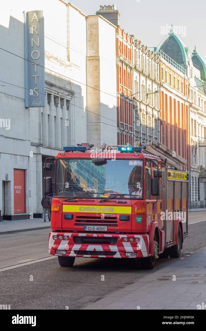 Fire Brigade truck in action on the street in the early morning, City ...