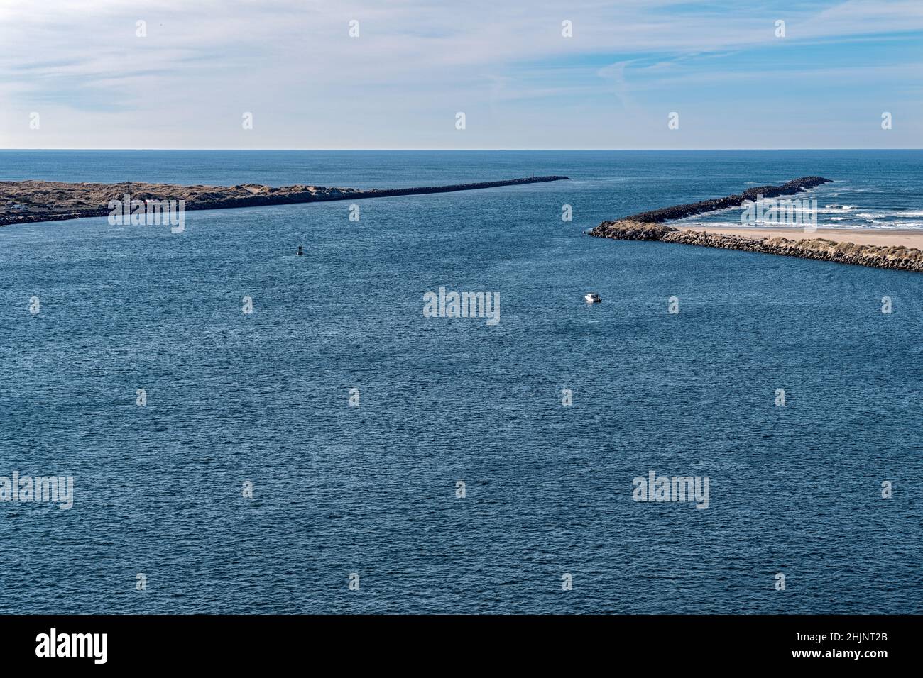 A boat going through the jetty at Newport in Oregon, USA Stock Photo ...
