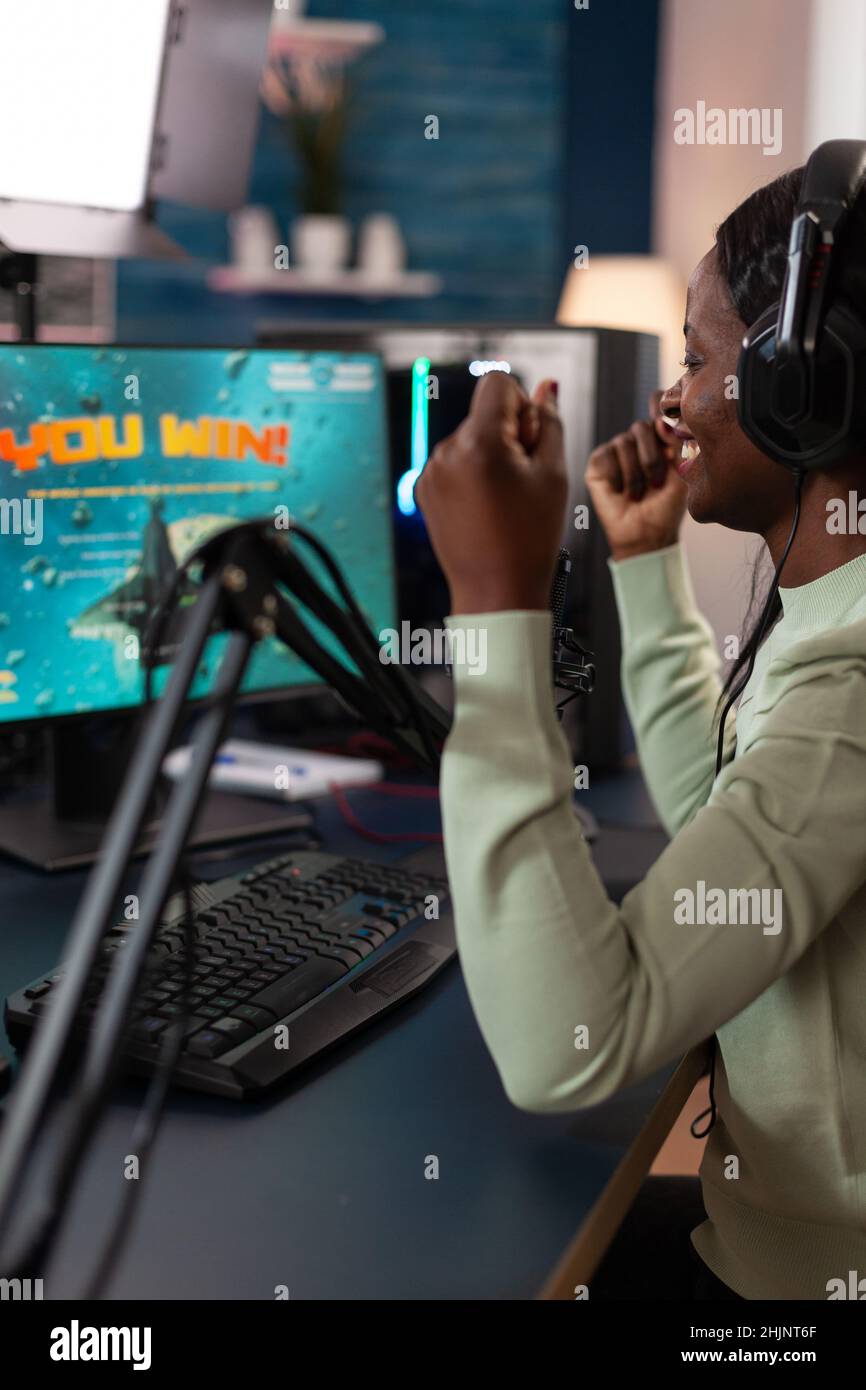 Excited winner pro gamer woman playing online videogames winning space ...