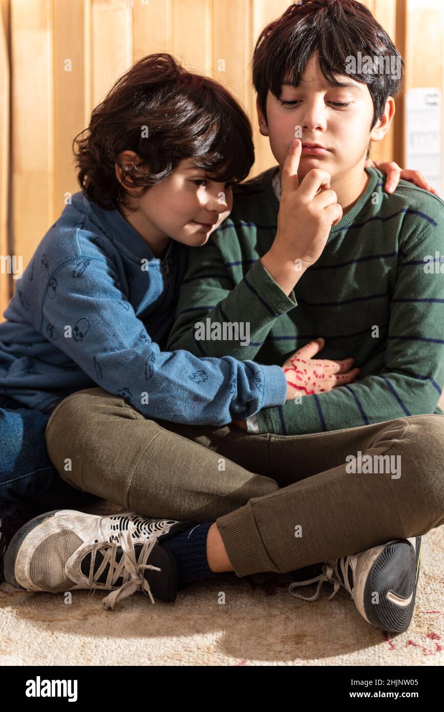 two brothers showing affection for each other Stock Photo - Alamy