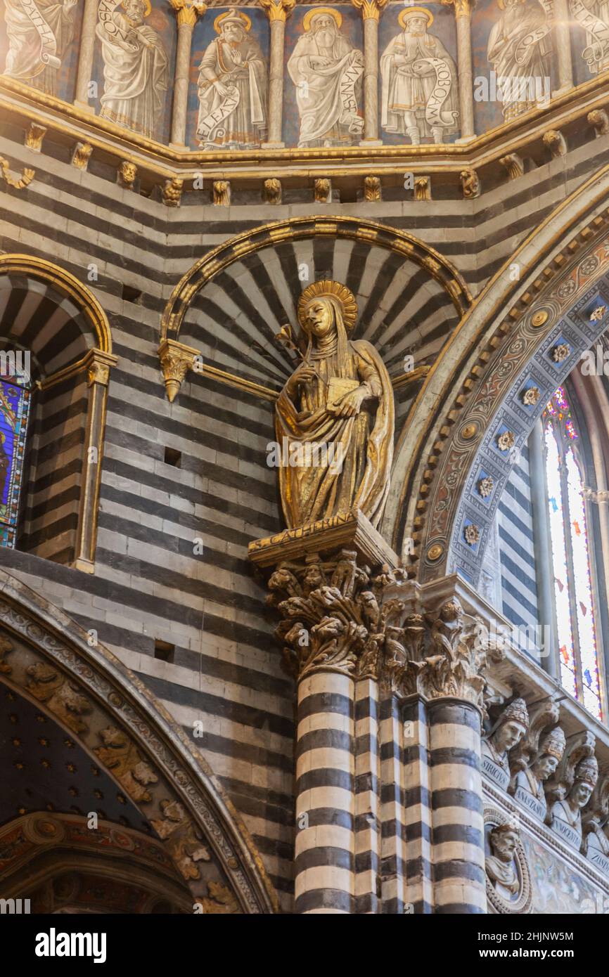 Gilded stuccon statue of St Catherine of Siena in Siena Cathedral ...