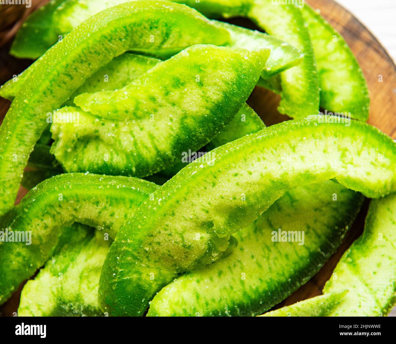 Dry chunks of pomelo on a plate on a white wooden background Stock ...