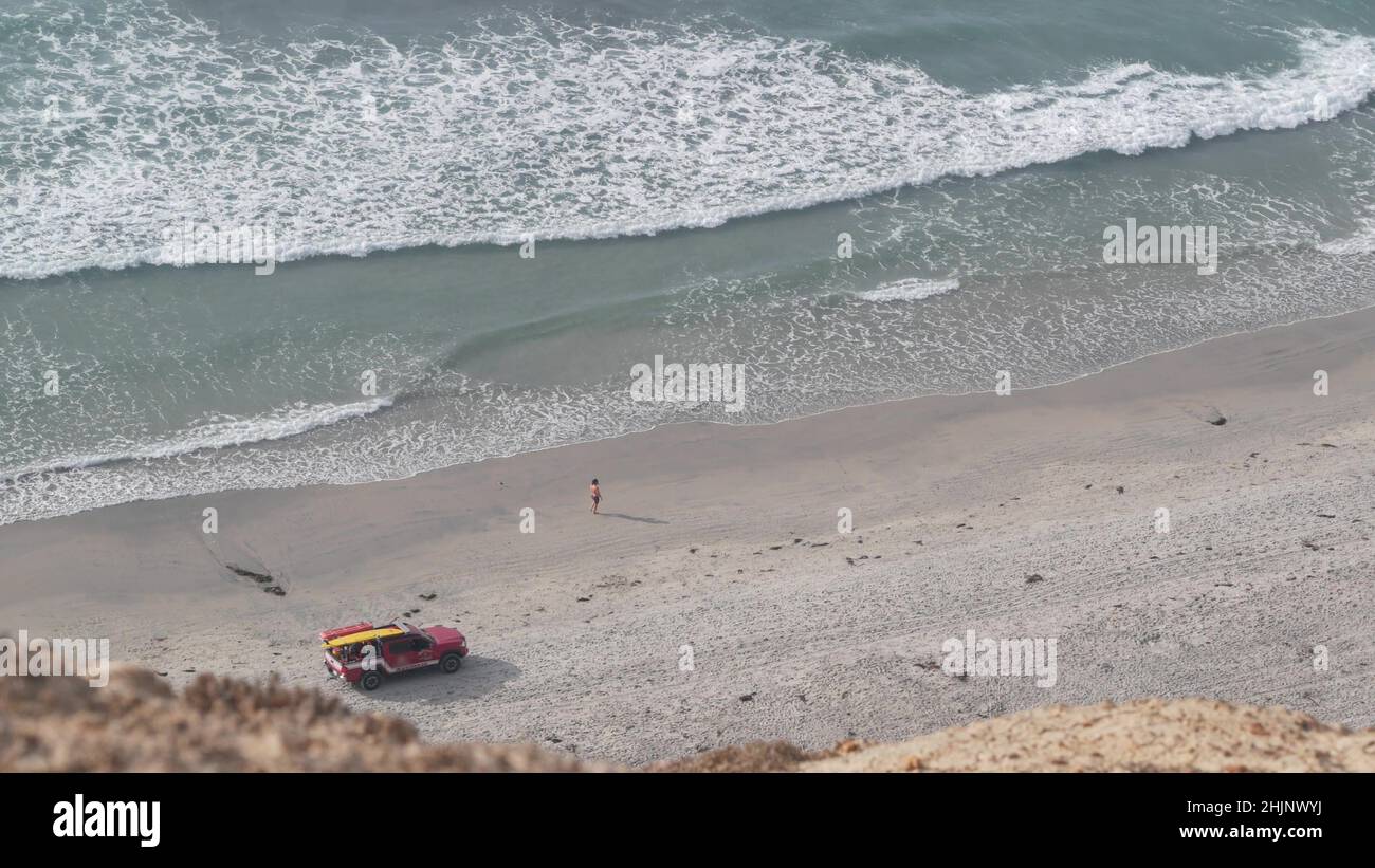 Lifeguard red pickup truck, life guard auto on sand, California ocean ...