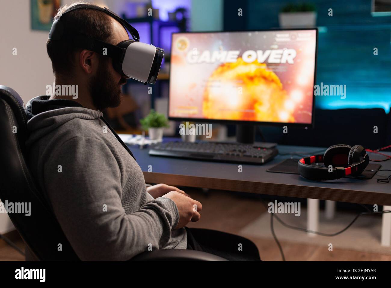 Adult using vr glasses to play video games on computer. Man with ...
