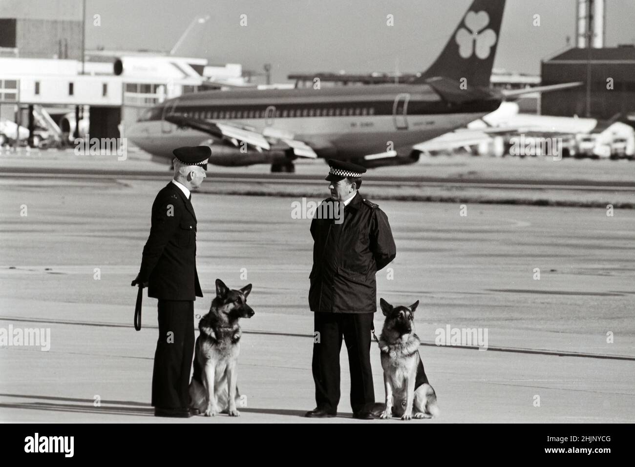 Two Policeman with Dogs providing security for Queen Elizabeth II at ...