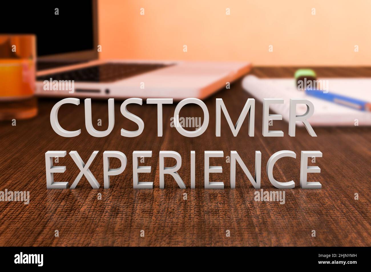 Customer Experience - letters on wooden desk with laptop computer and a ...