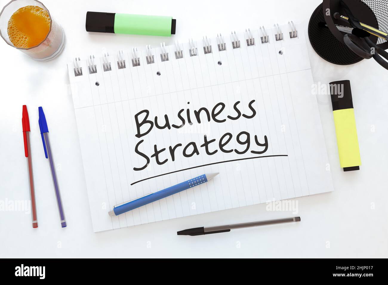 Business Strategy - handwritten text in a notebook on a desk - 3d ...