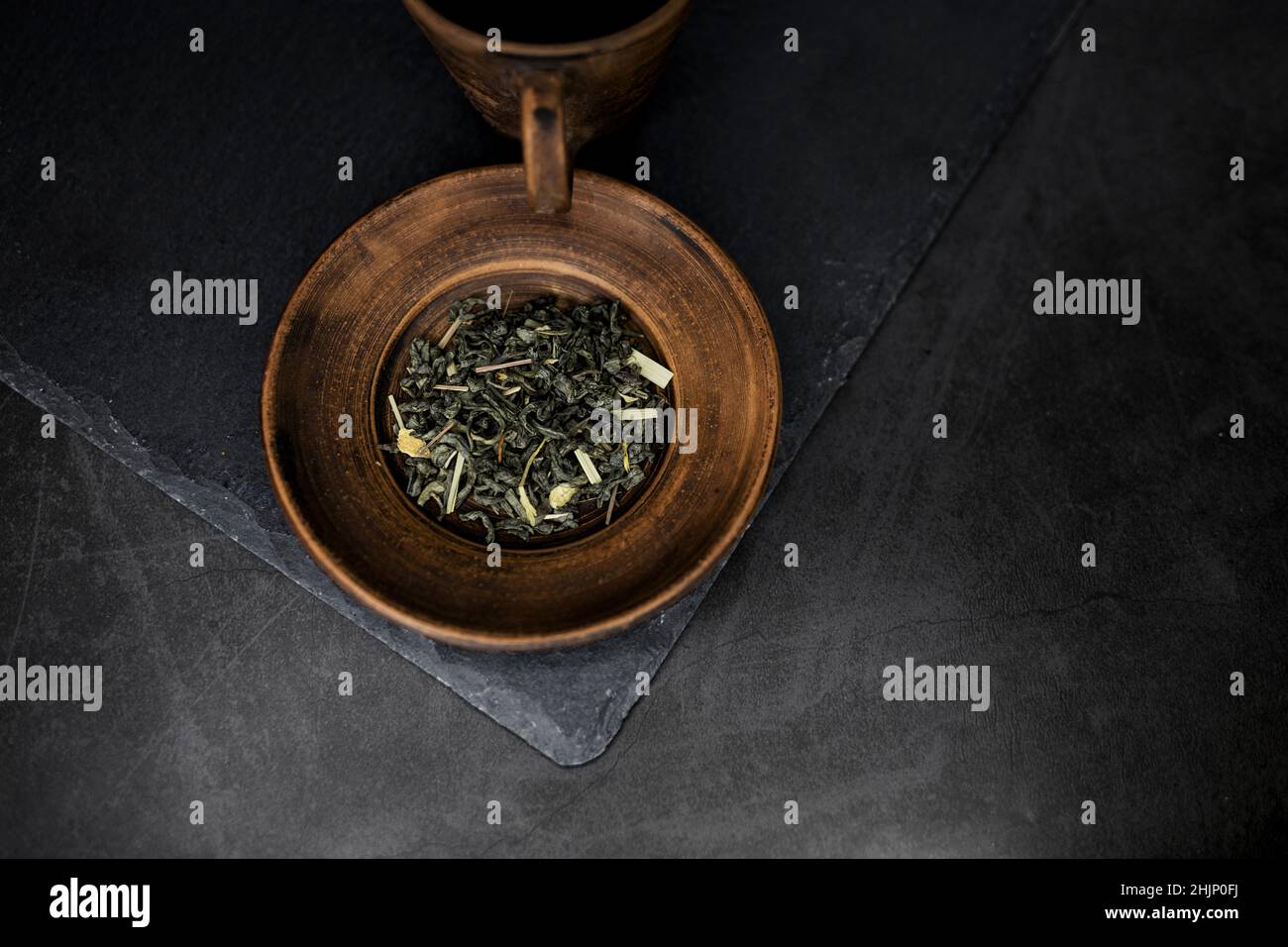 Antique plate with tea on dark background. Top view. Tea ceremony Stock ...