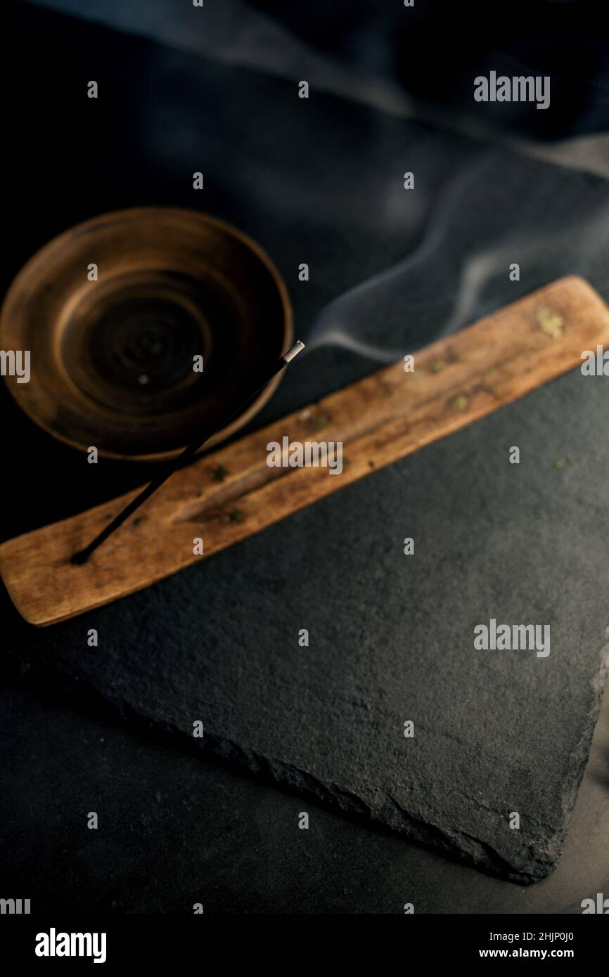 Lit incense stick with smoke. Meditation and Yoga Stock Photo - Alamy